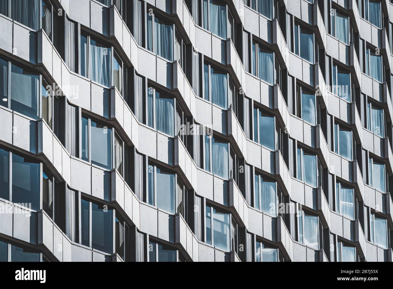 Irregular facade of an urban building creating a pattern Stock Photo ...