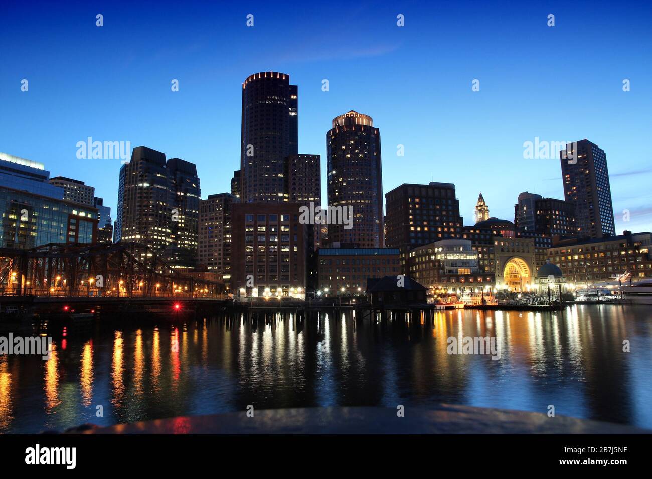 Boston night skyline - evening Waterfront view of the city Stock Photo ...