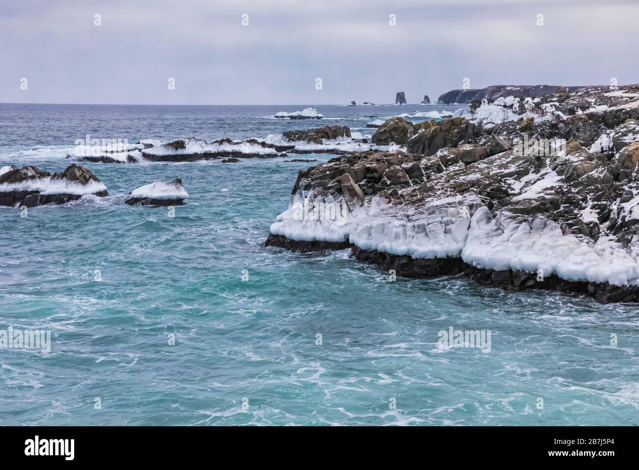 The rugged and rocky coastline of Dungeon Provincial Park in winter ...