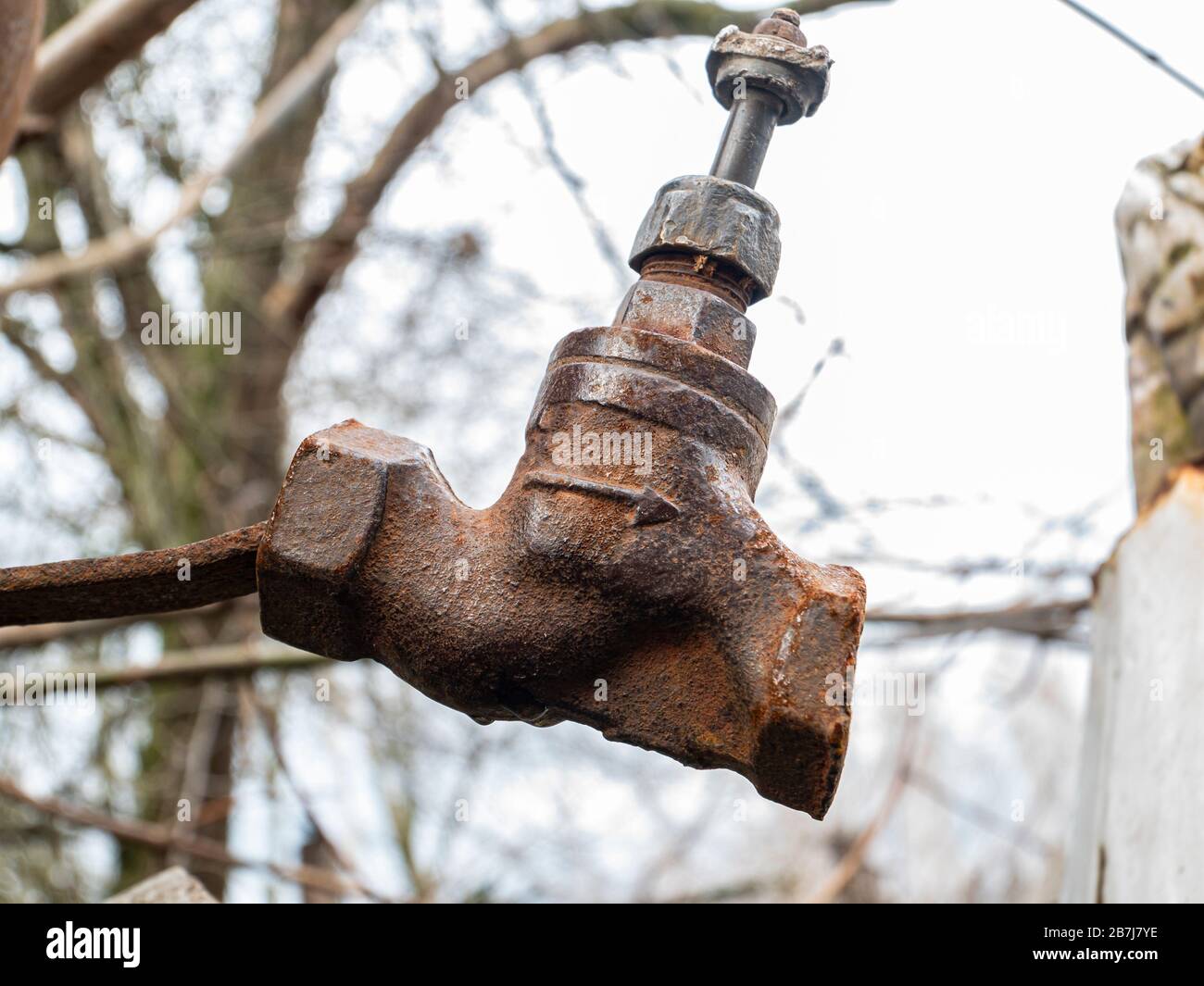 Old plumbing water tap with a metal valve Stock Photo - Alamy