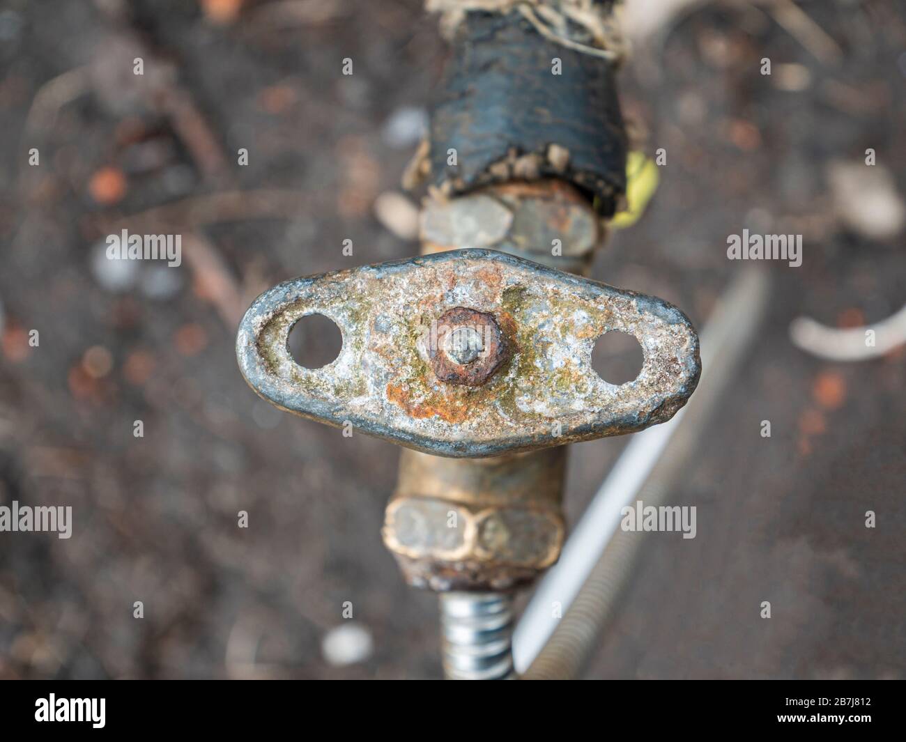Old plumbing water tap with a metal valve Stock Photo - Alamy