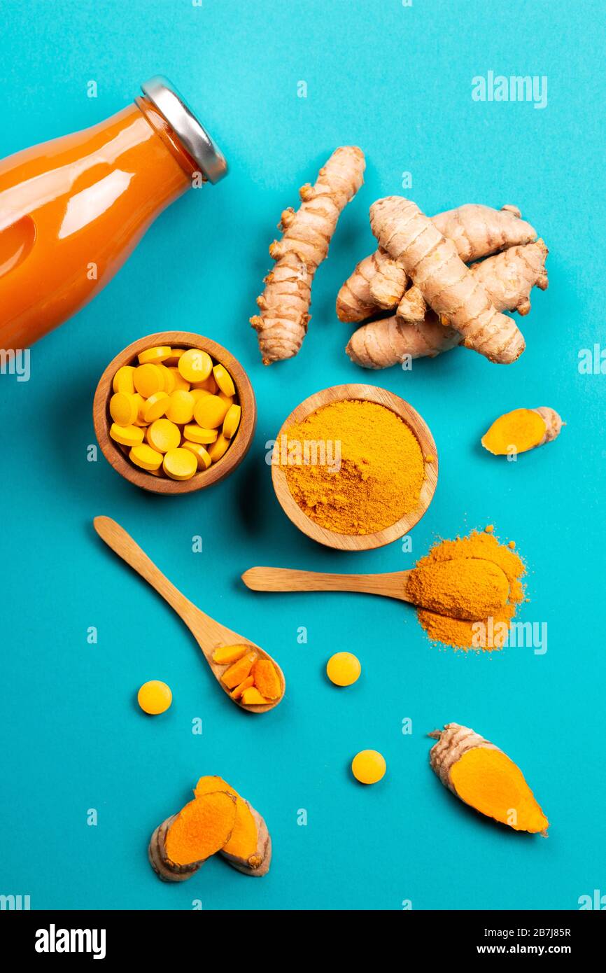 Turmeric in different states: fresh in bottle, pills, powder and cut ...