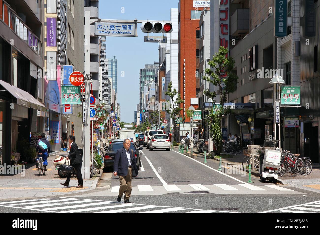 NAGOYA, JAPAN - APRIL 28, 2012: People walk in downtown Nagoya, Japan ...