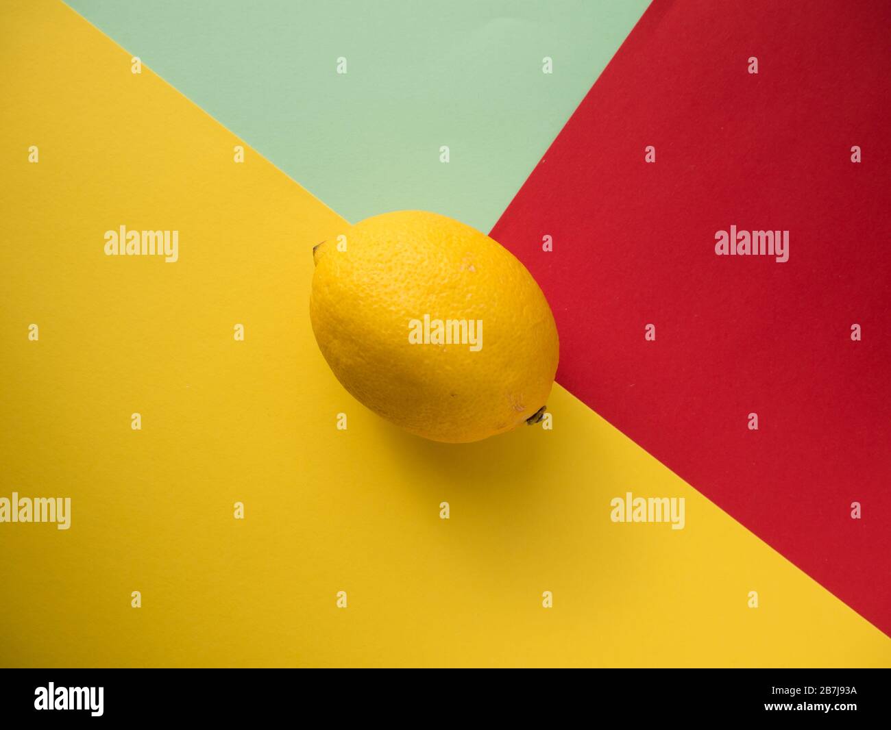 Lemon on a colored background, top view. Trendy colorful photo. Minimal ...