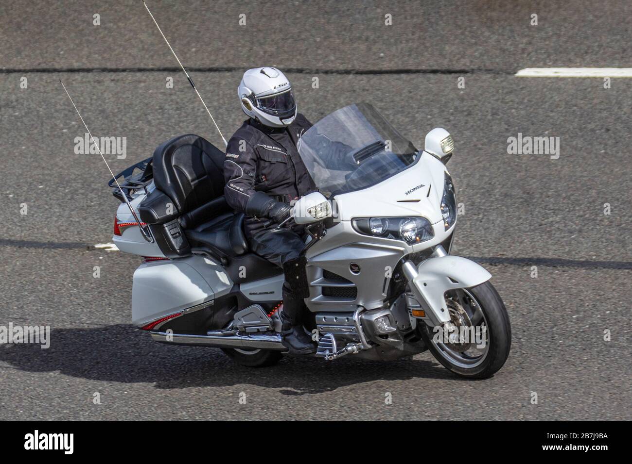 Honda motorcycle rider; Vehicular traffic, two wheeled transport ...