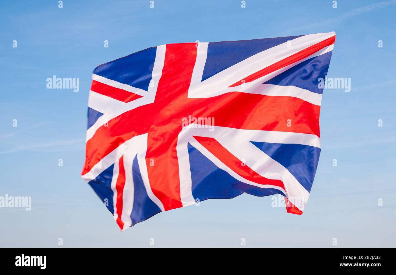 National Flag of United kingdom. British flag on blue sky background ...