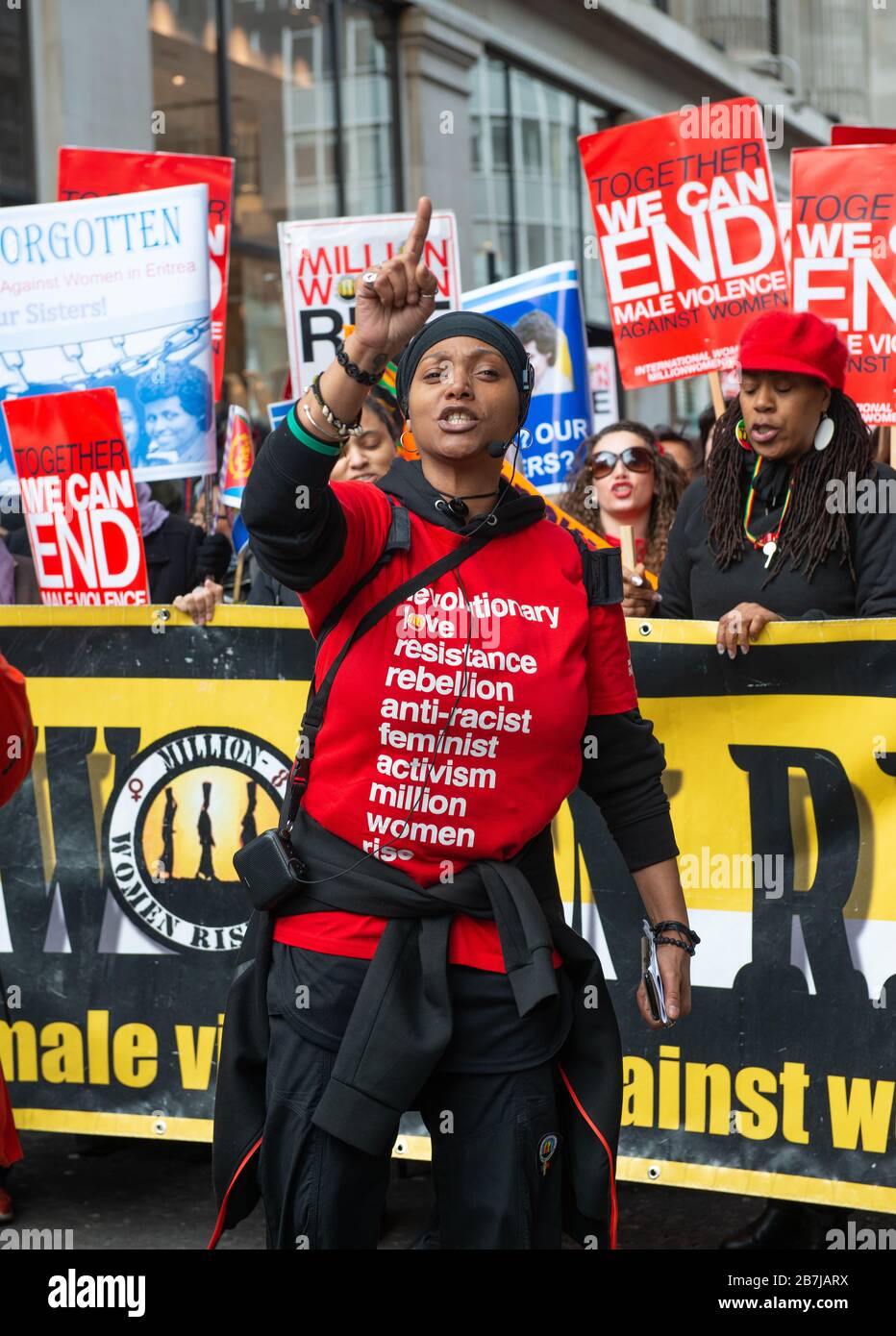 Female protesters with banners at the Million Women Rise demonstration ...