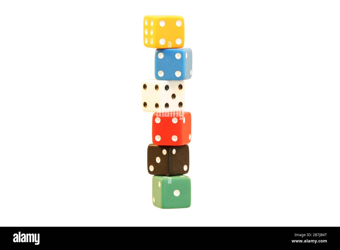 Balancing Act: 6 different coloured dice lying upon another on white ...