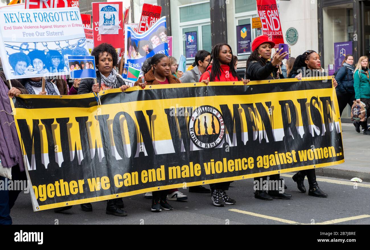 Female protesters with banners at the Million Women Rise demonstration ...