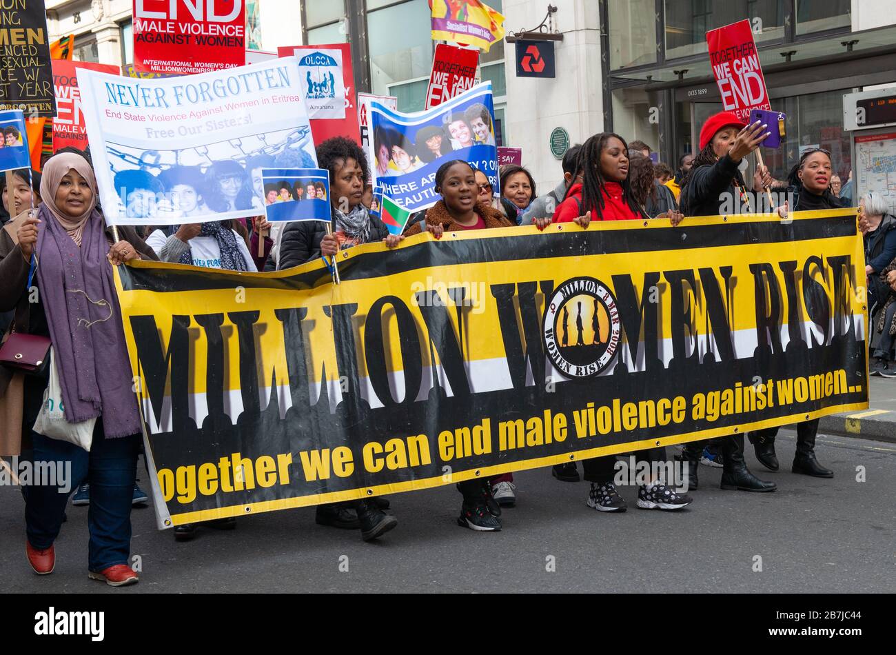 Female Protesters With Banners At The Million Women Rise Demonstration