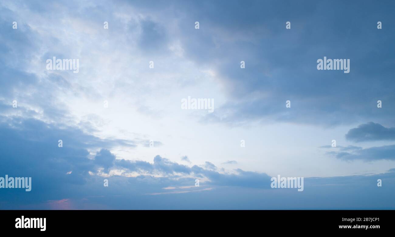 Beautiful sky with stretched clouds during twilight Stock Photo - Alamy