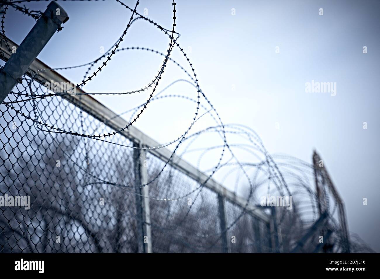 Border fence with barbed wire. Closing for quarantine. Maximum Security ...