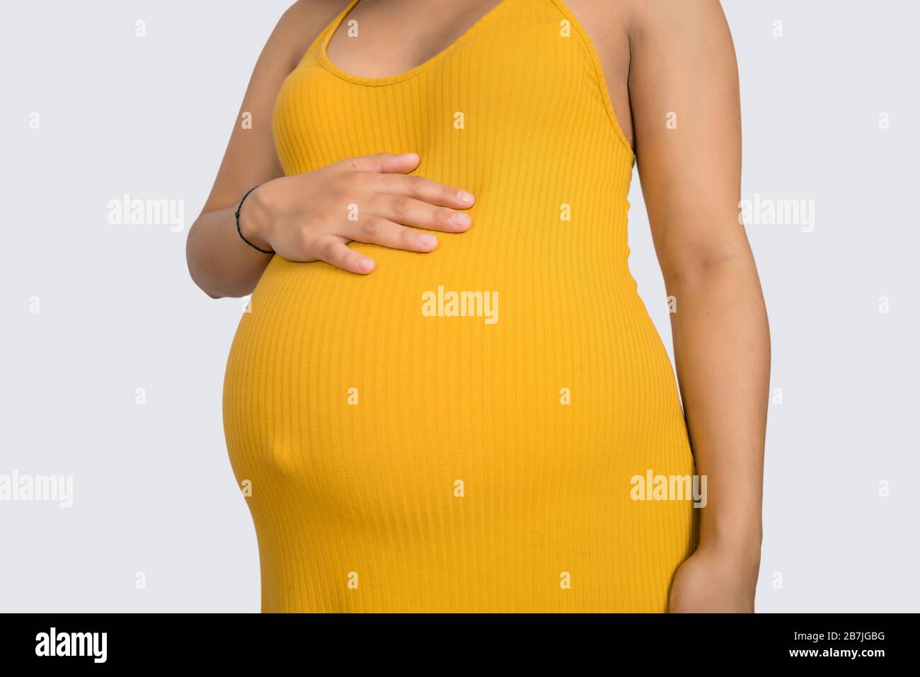Close Up Of Pregnant Woman Touching Her Big Belly Pregnancy Motherhood And Expectation Concept