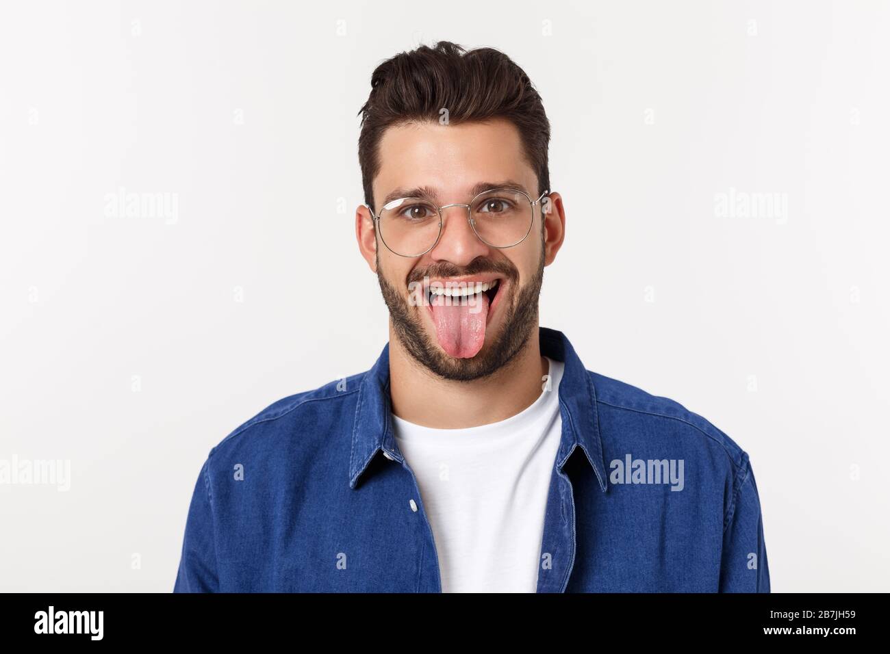 Casual handsome young man looking at camera satisfaction feeling Stock ...