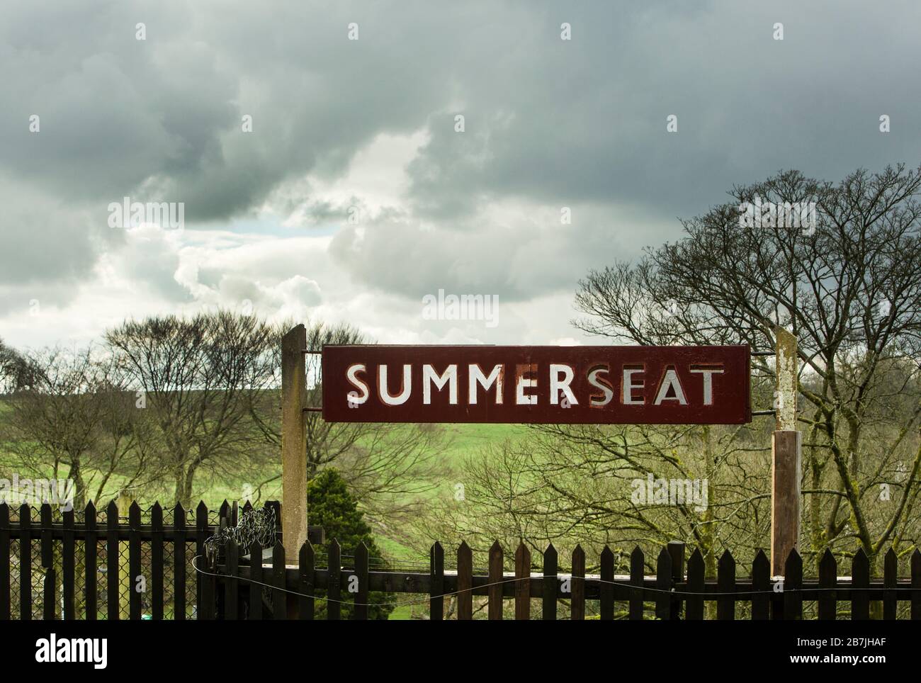 Traditional claret coloured (British Railways style) railway sign at ...