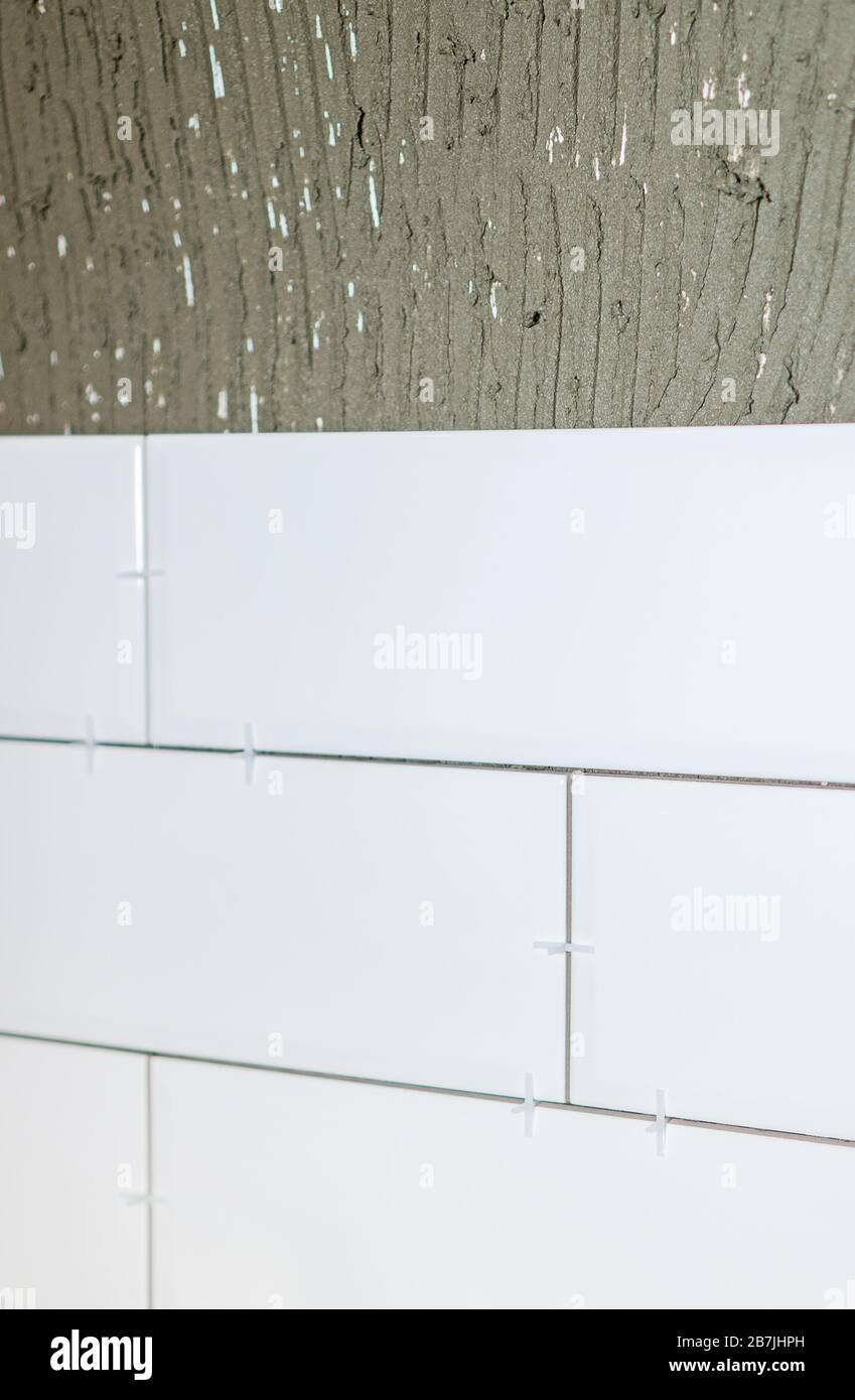 Fitting tiles hi-res stock photography and images - Alamy