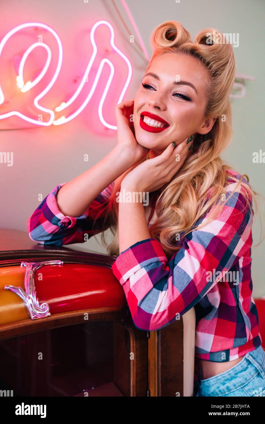 Photo of young joyful woman with beautiful hairstyle smiling while ...