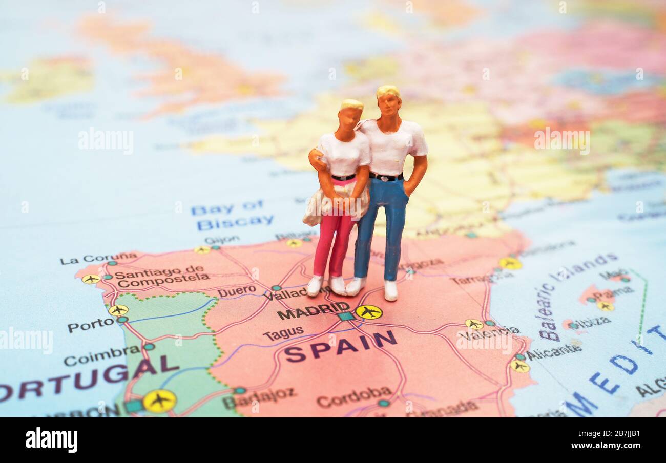 Figures of the couple on a map of Spain Stock Photo - Alamy