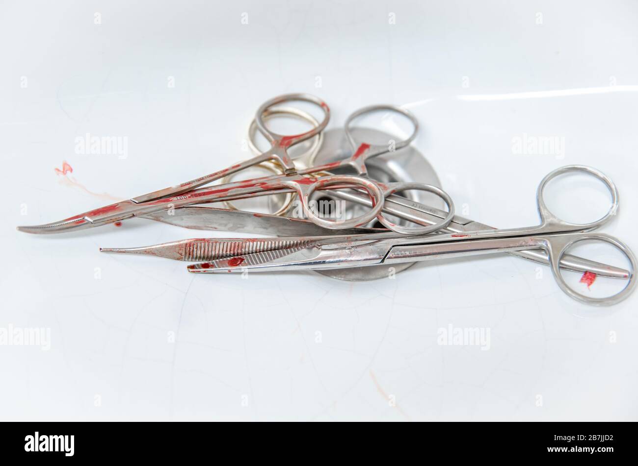 Surgical instruments with traces of blood in a sink for cleaning after ...