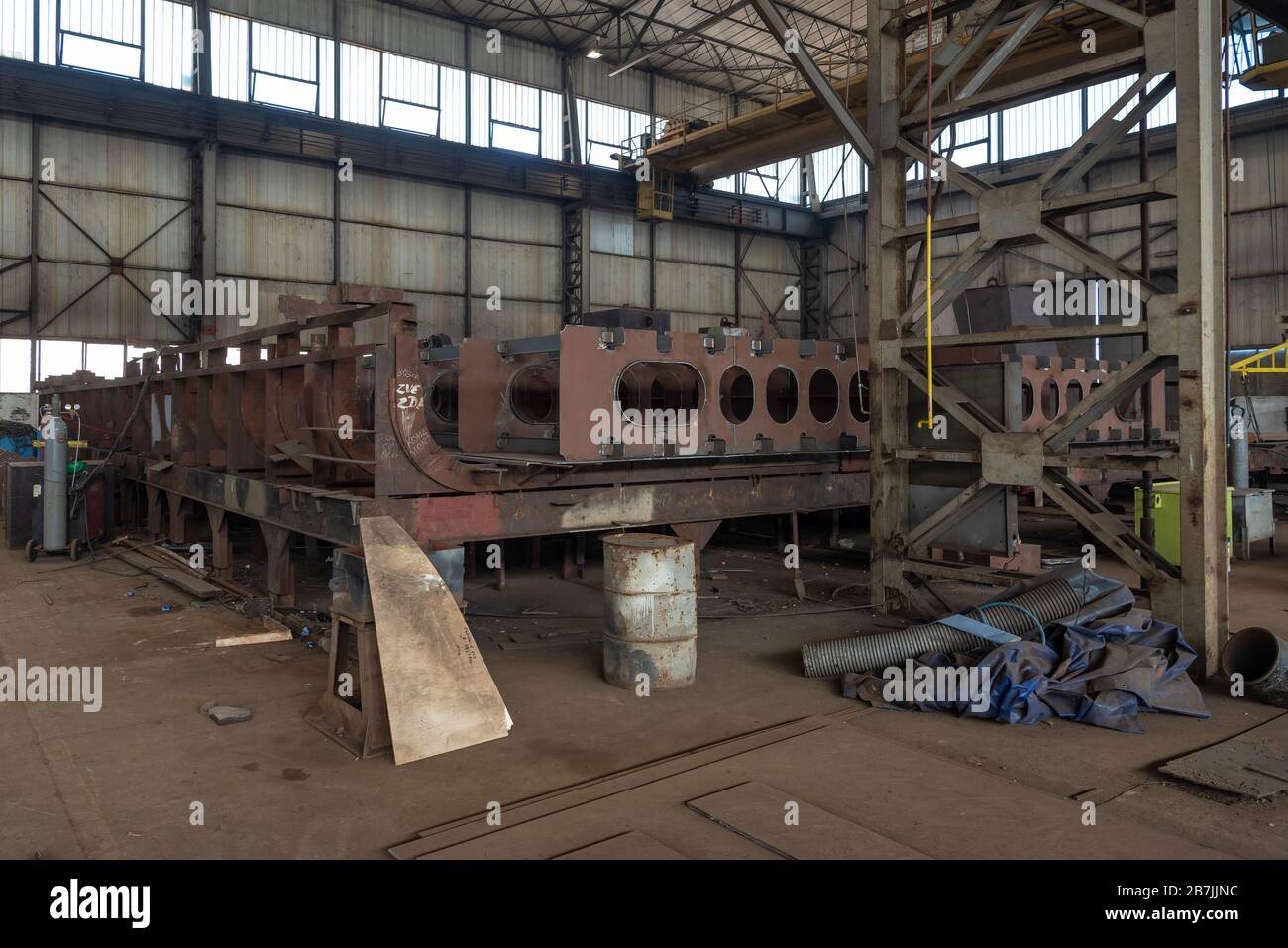 shipyard workers are working in the hangar to build a new ship Stock ...