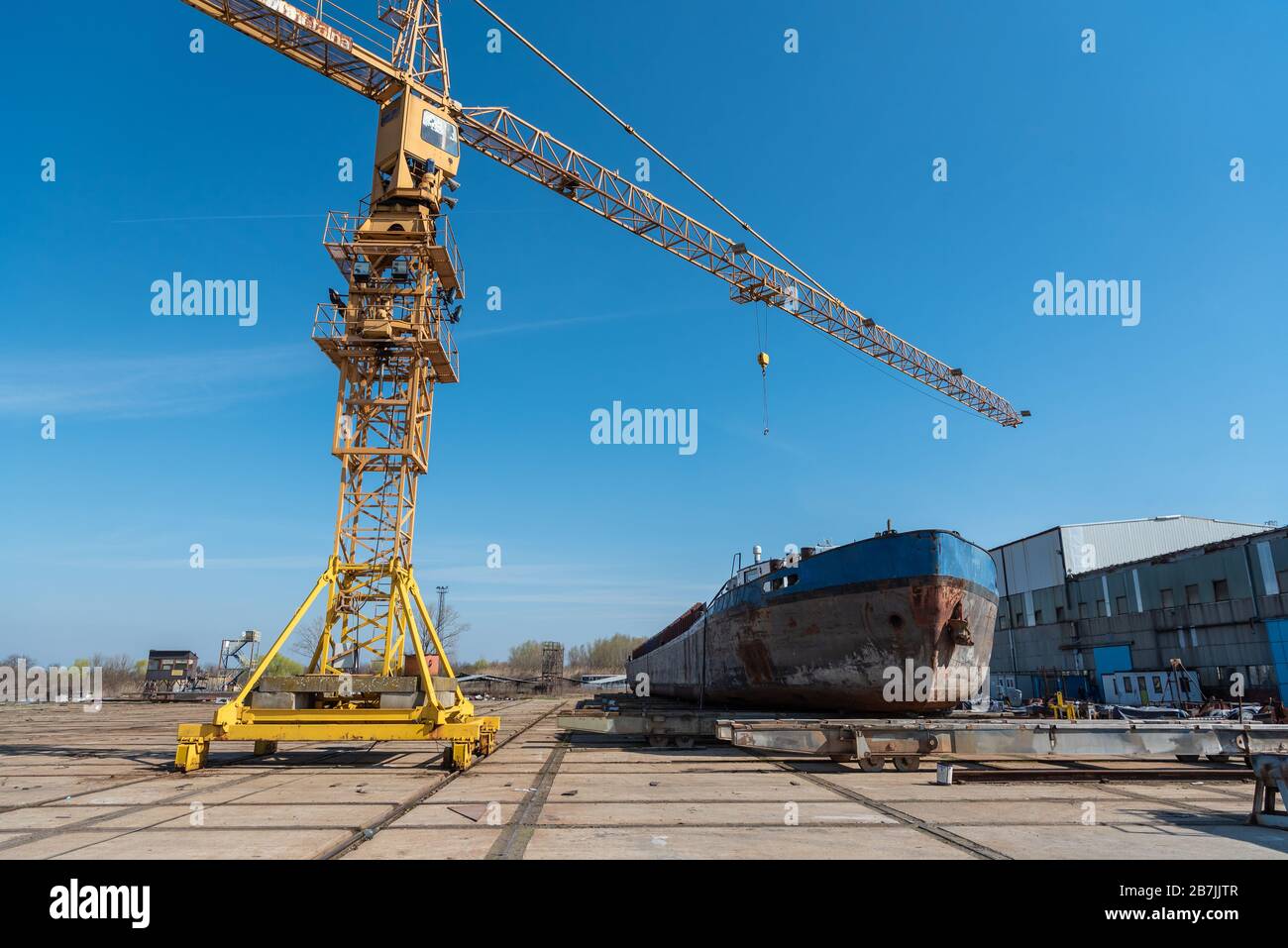 shipyard workers are working in the hangar to build a new ship Stock ...