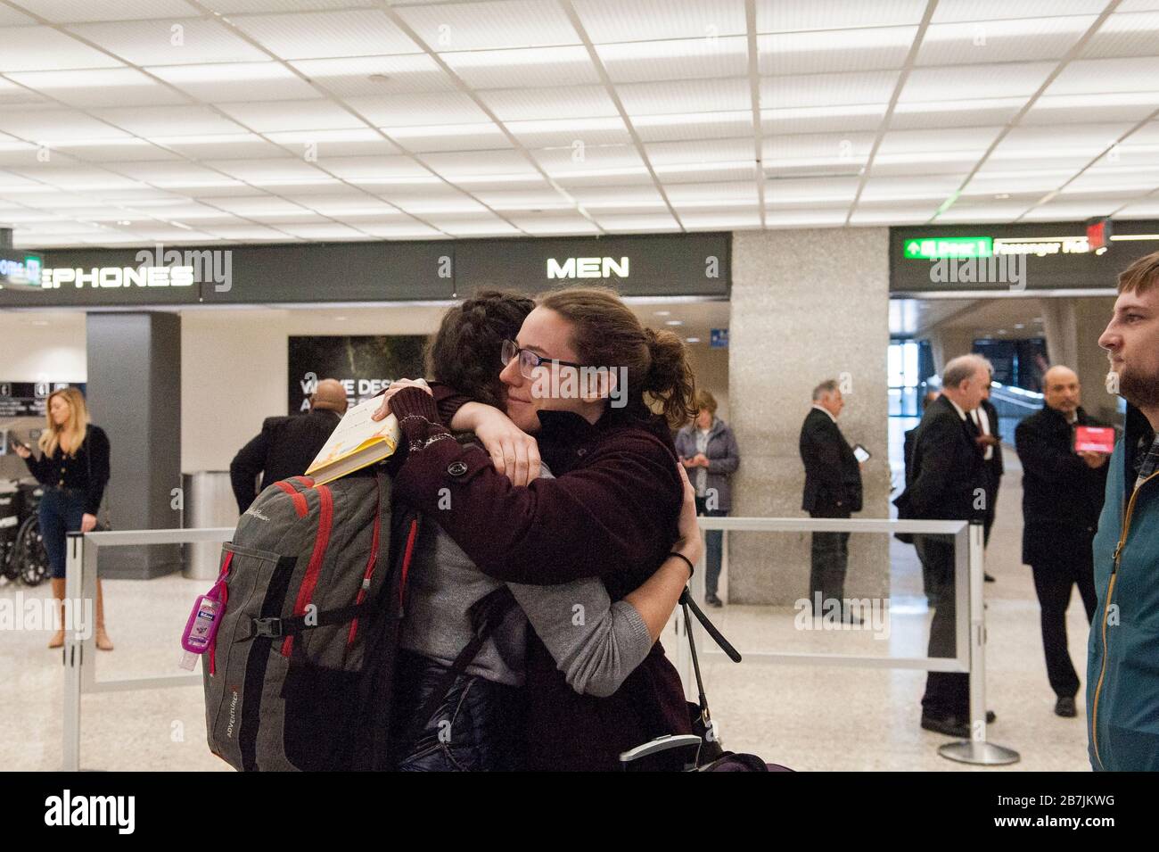 Passengers are greeted upon their arrival from Dubai after a 14-hour ...