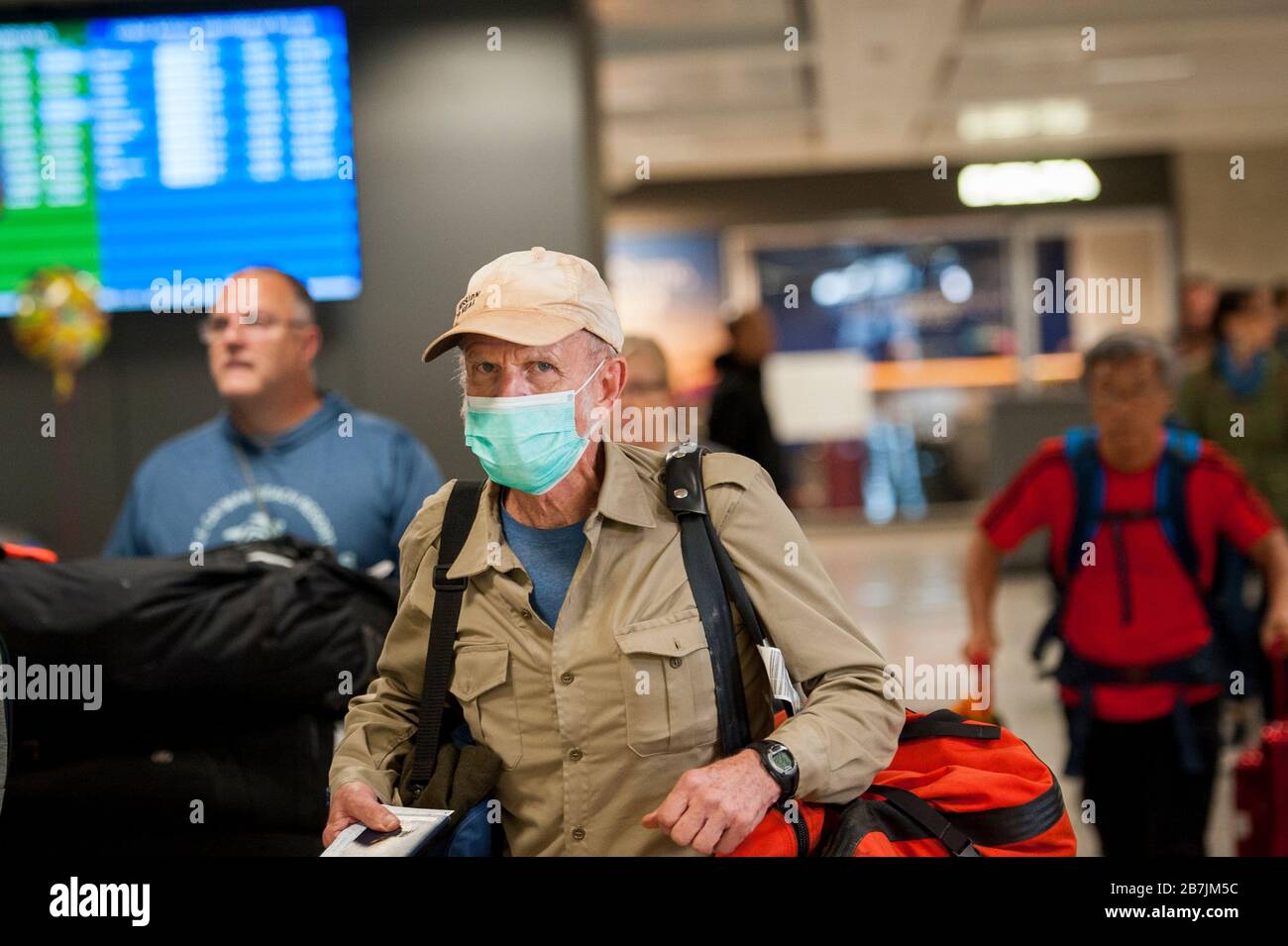 Passengers arrive from Dubai after a 14-hour flight on Emirates flight ...