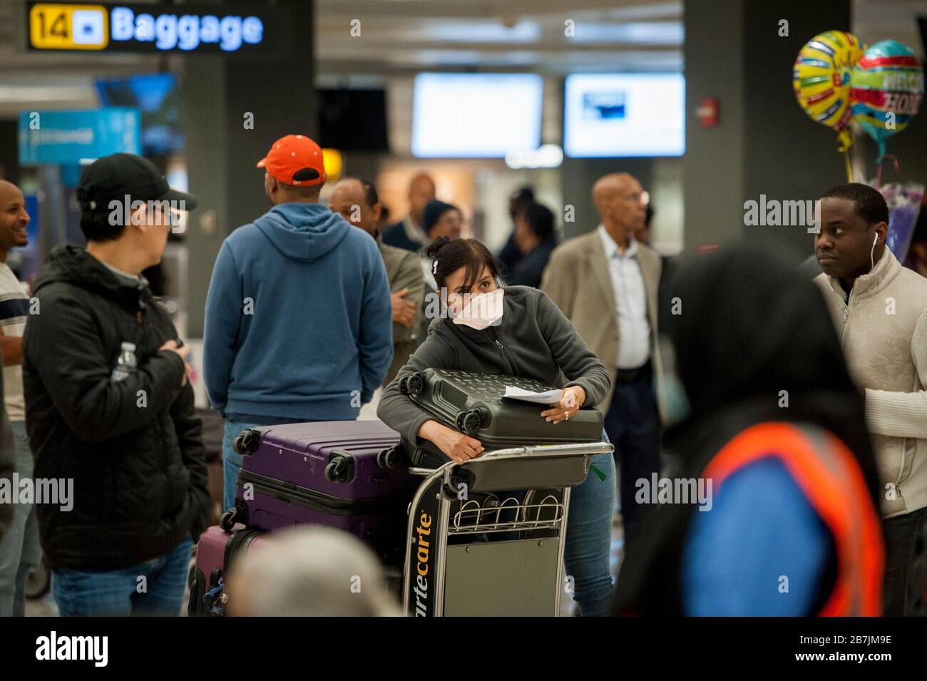 Passengers arrive from Dubai after a 14-hour flight on Emirates flight ...