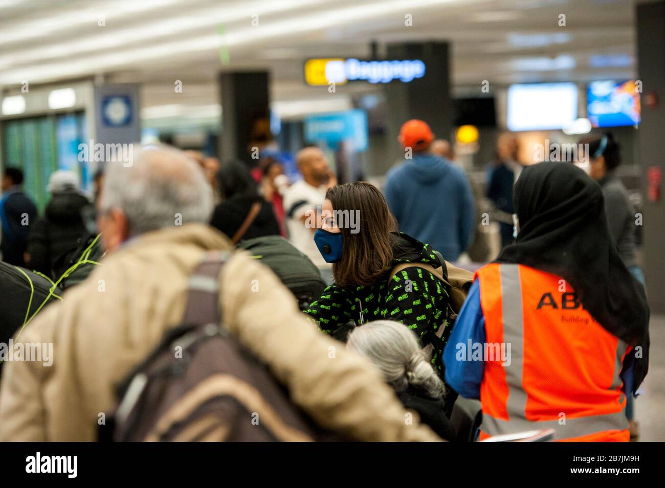 Passengers arrive from Dubai after a 14-hour flight on Emirates flight ...