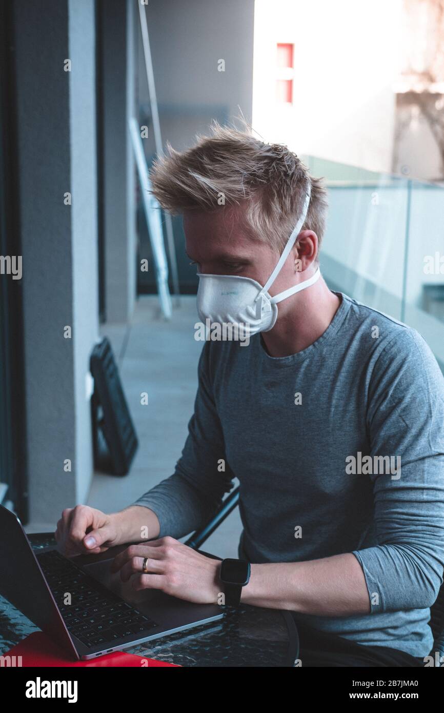 Sick man working laptop wearing hi-res stock photography and images - Alamy