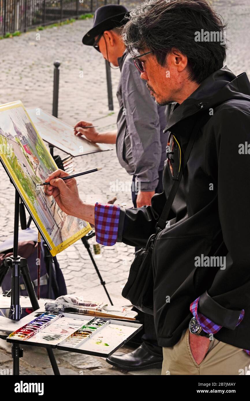 artists painting on Paris France street Stock Photo - Alamy