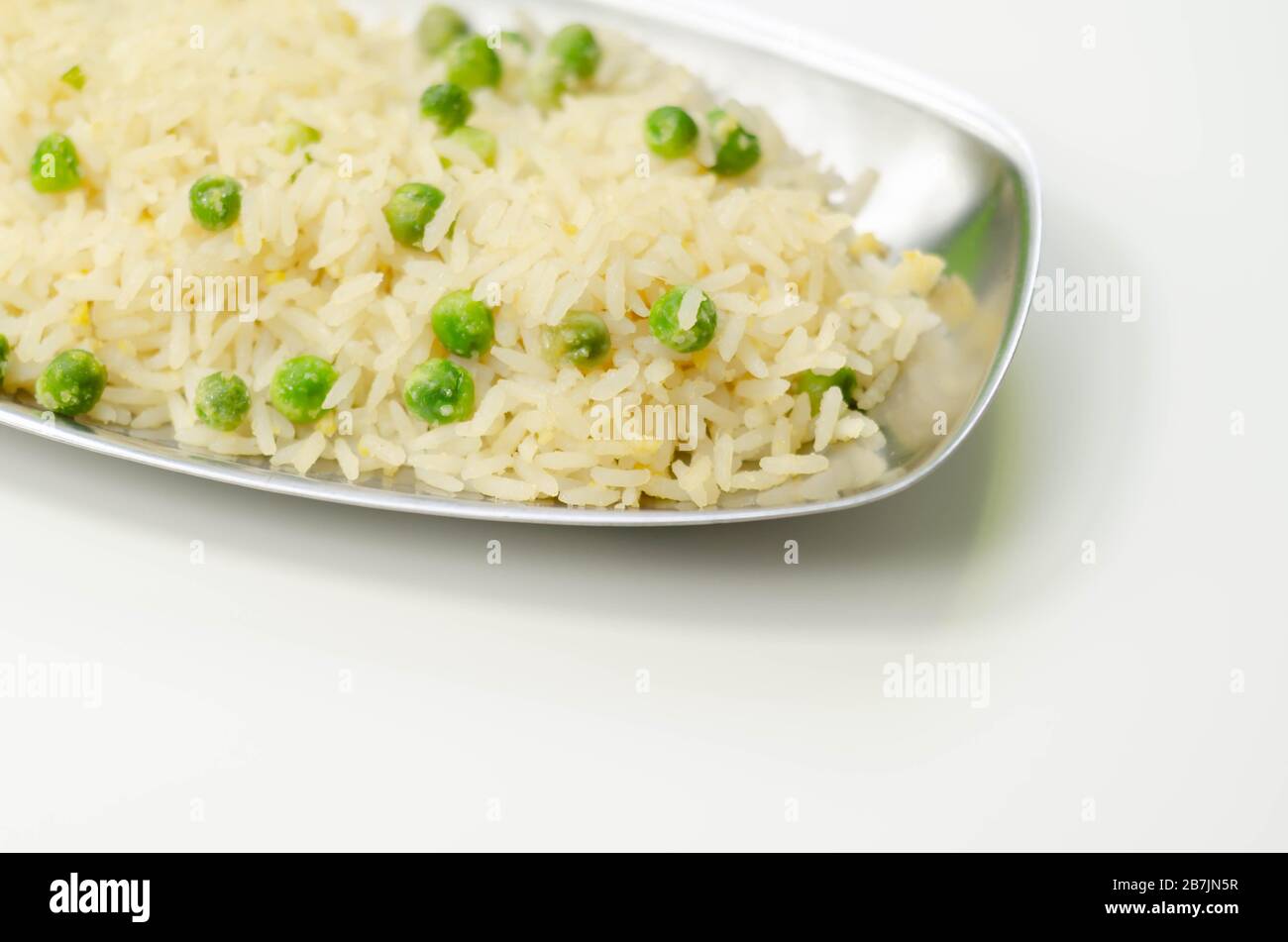 Egg fried rice served on the metal tray, an addition to an Indian or ...