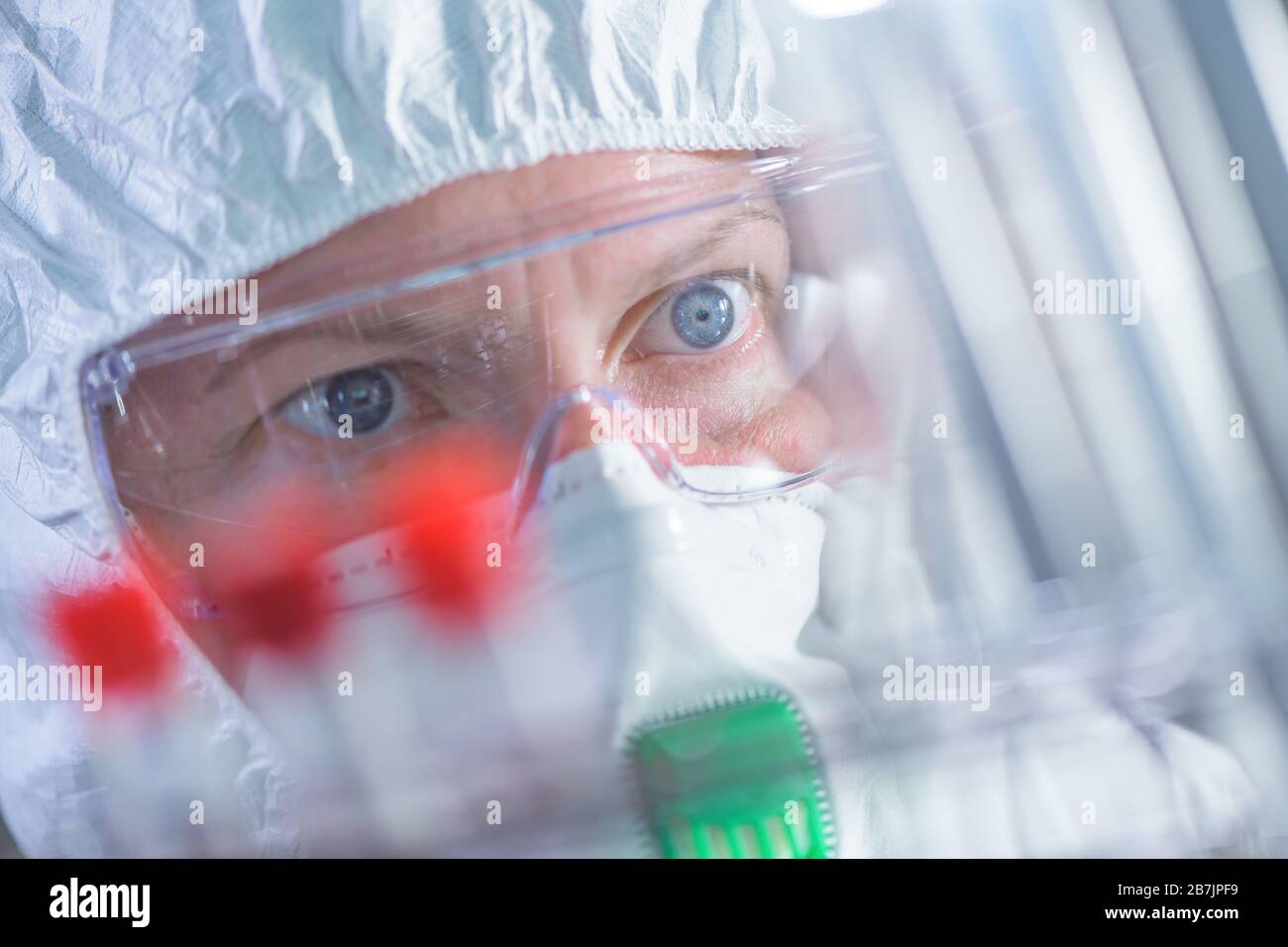 Virologist healthcare professional analyzing blood test sample in lab ...