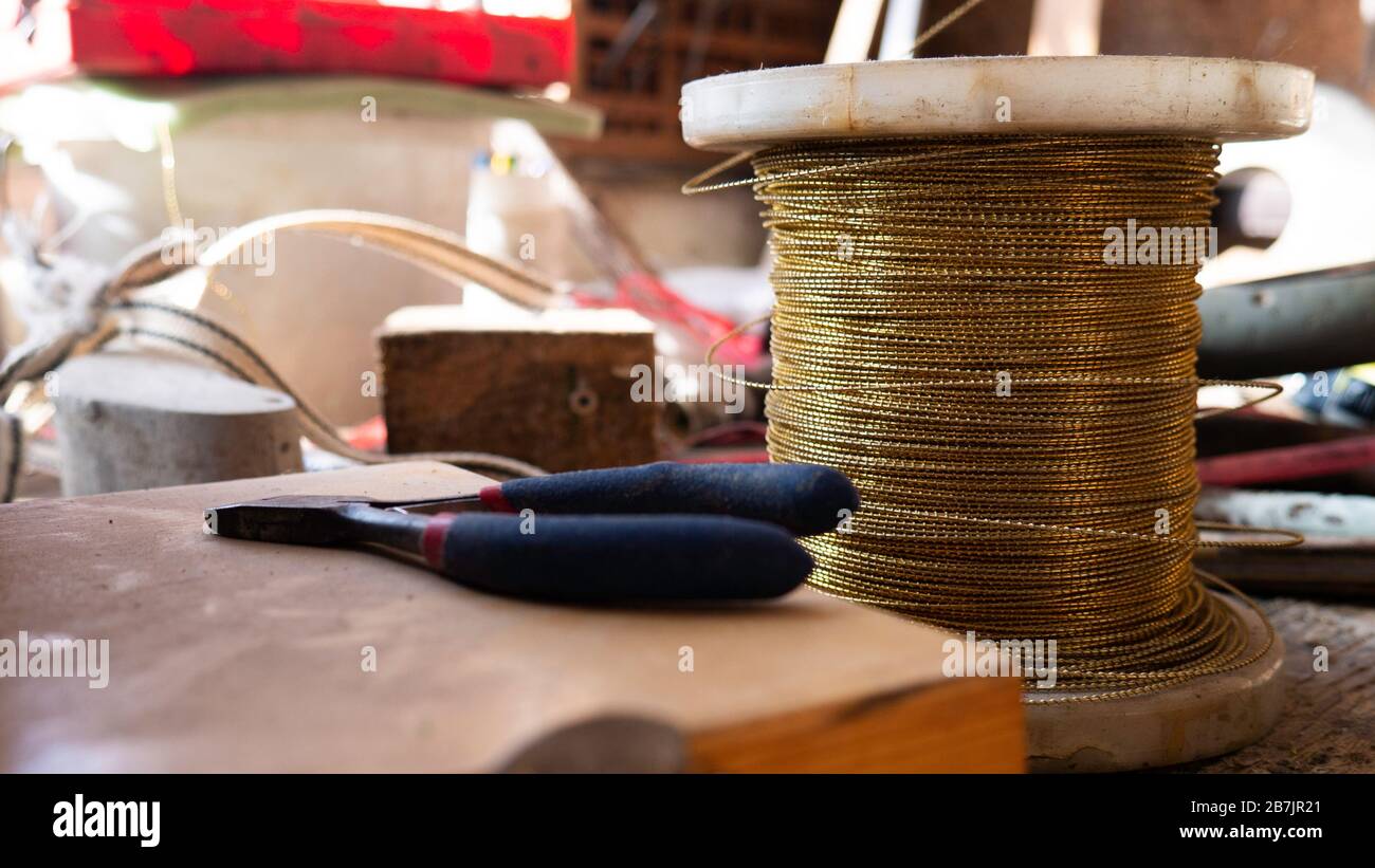 Copper wire winding in workshop Stock Photo - Alamy
