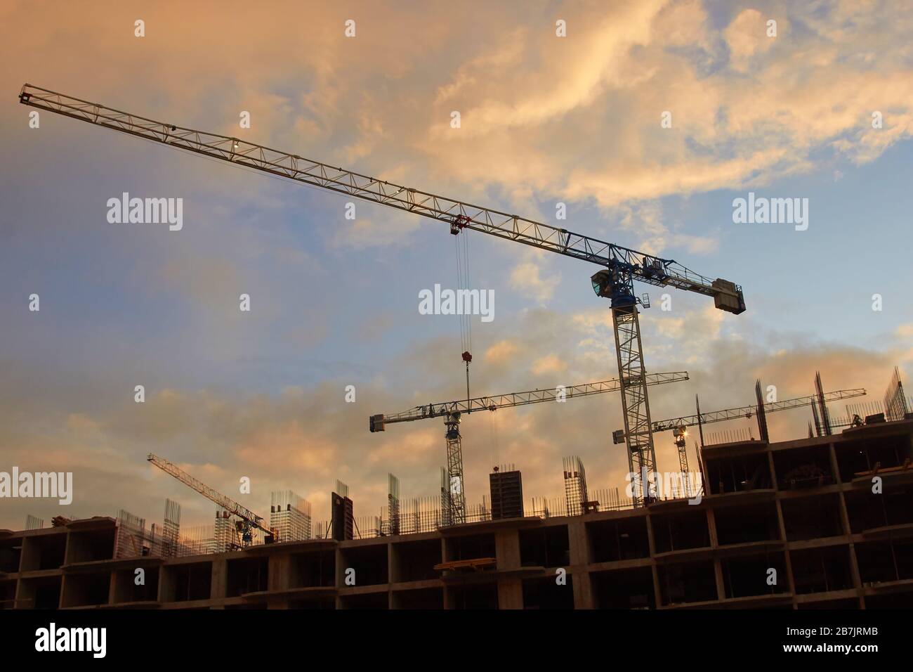 Industrial construction cranes the construction of an building Stock ...