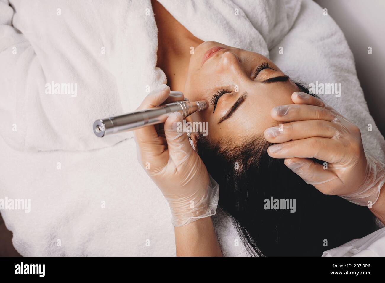 Upper view of ca skin care procedure made with modern apparatus at the ...