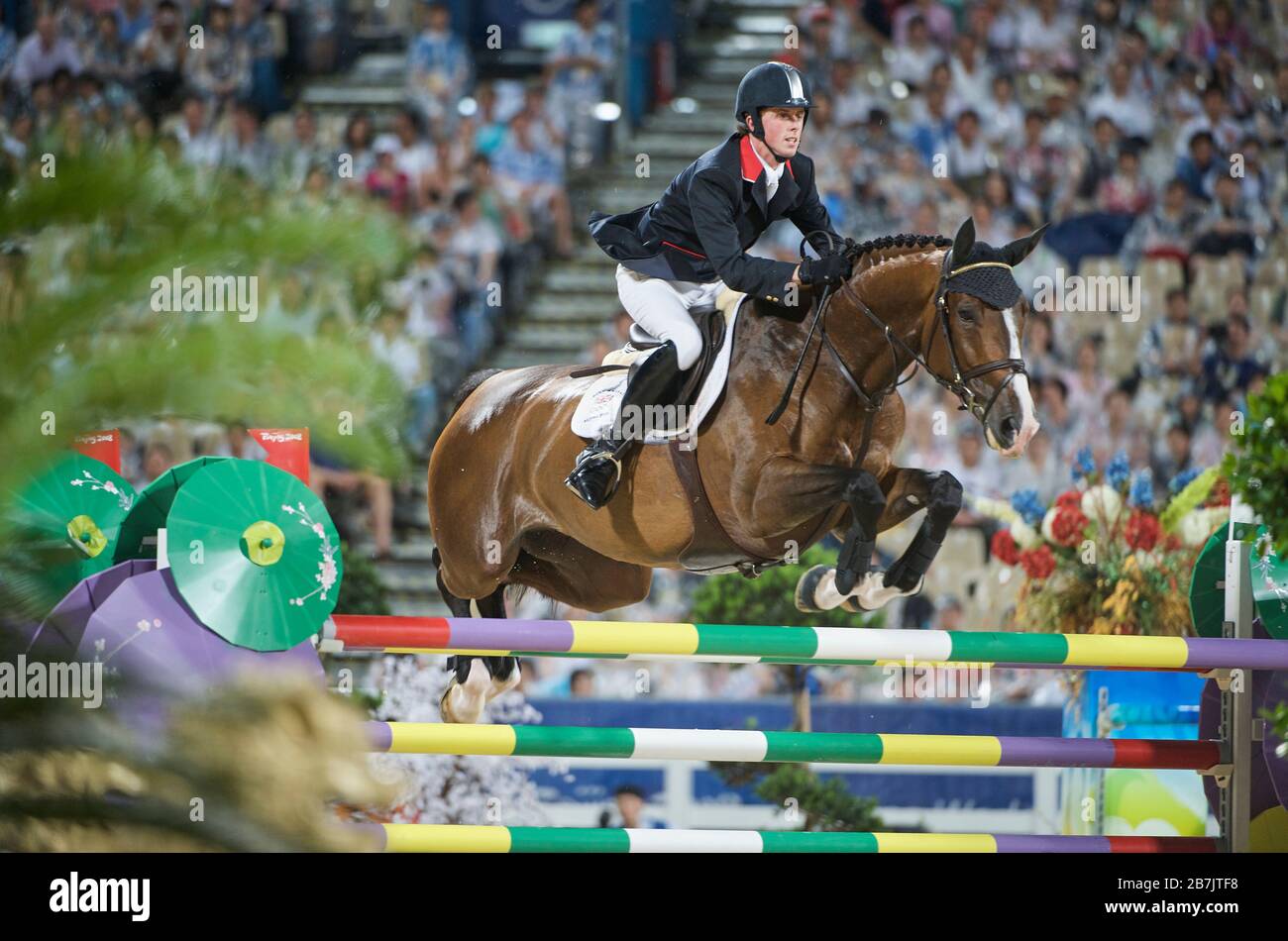 Riding horse jumping hi-res stock photography and images - Alamy