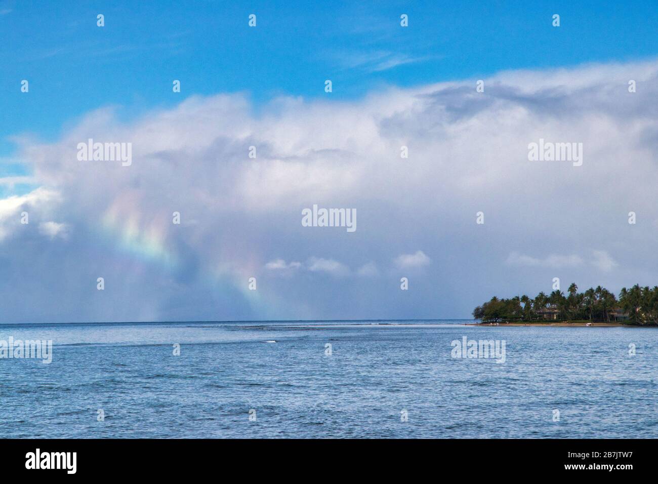Stunning rainbow cloud over the horizon in the ocean near Lahaina on ...
