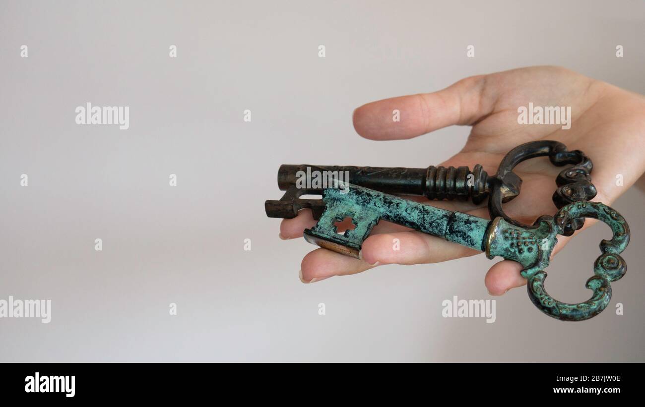 Two corkscrew for opening bottles in the form of a key in a woman's ...