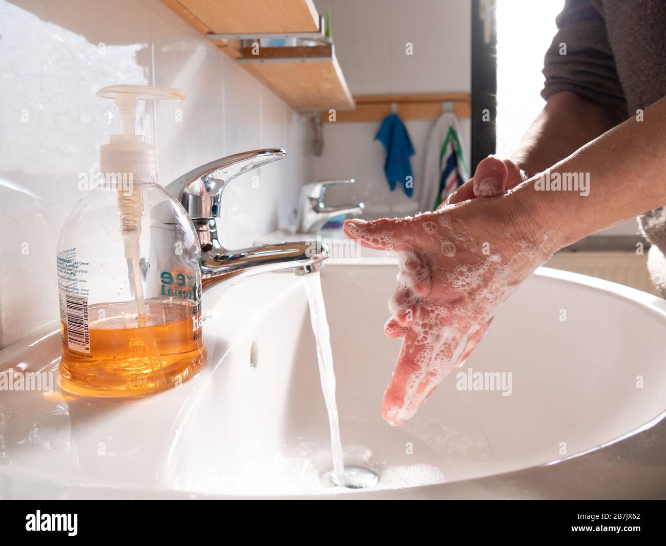 Washing hands as protection against disease germs Stock Photo - Alamy