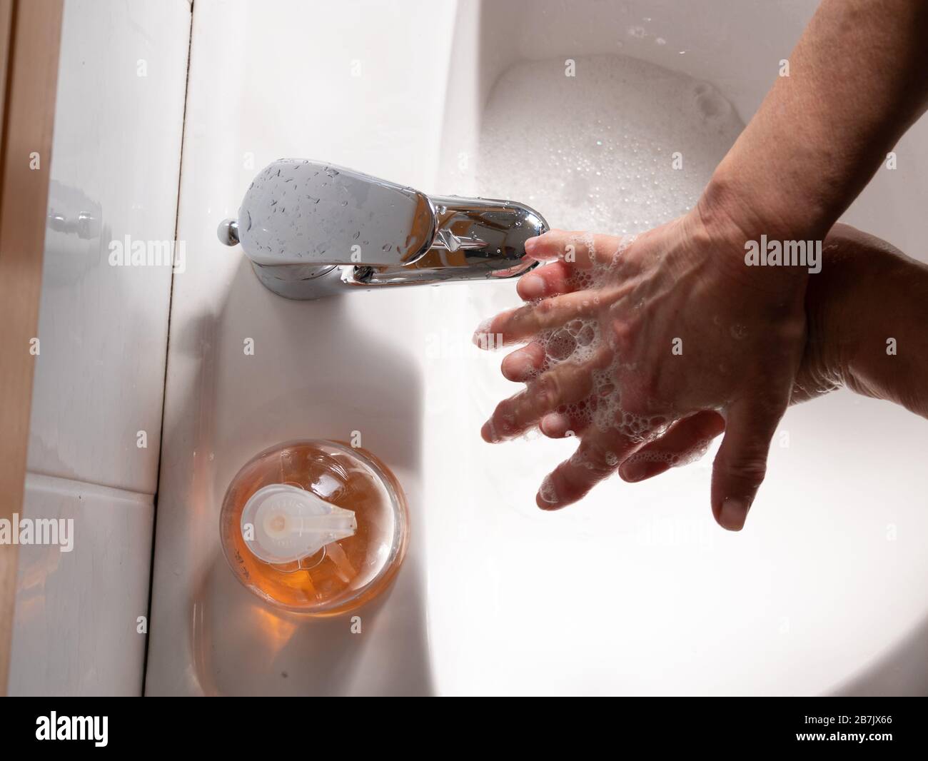 Washing hands as protection against disease germs Stock Photo - Alamy