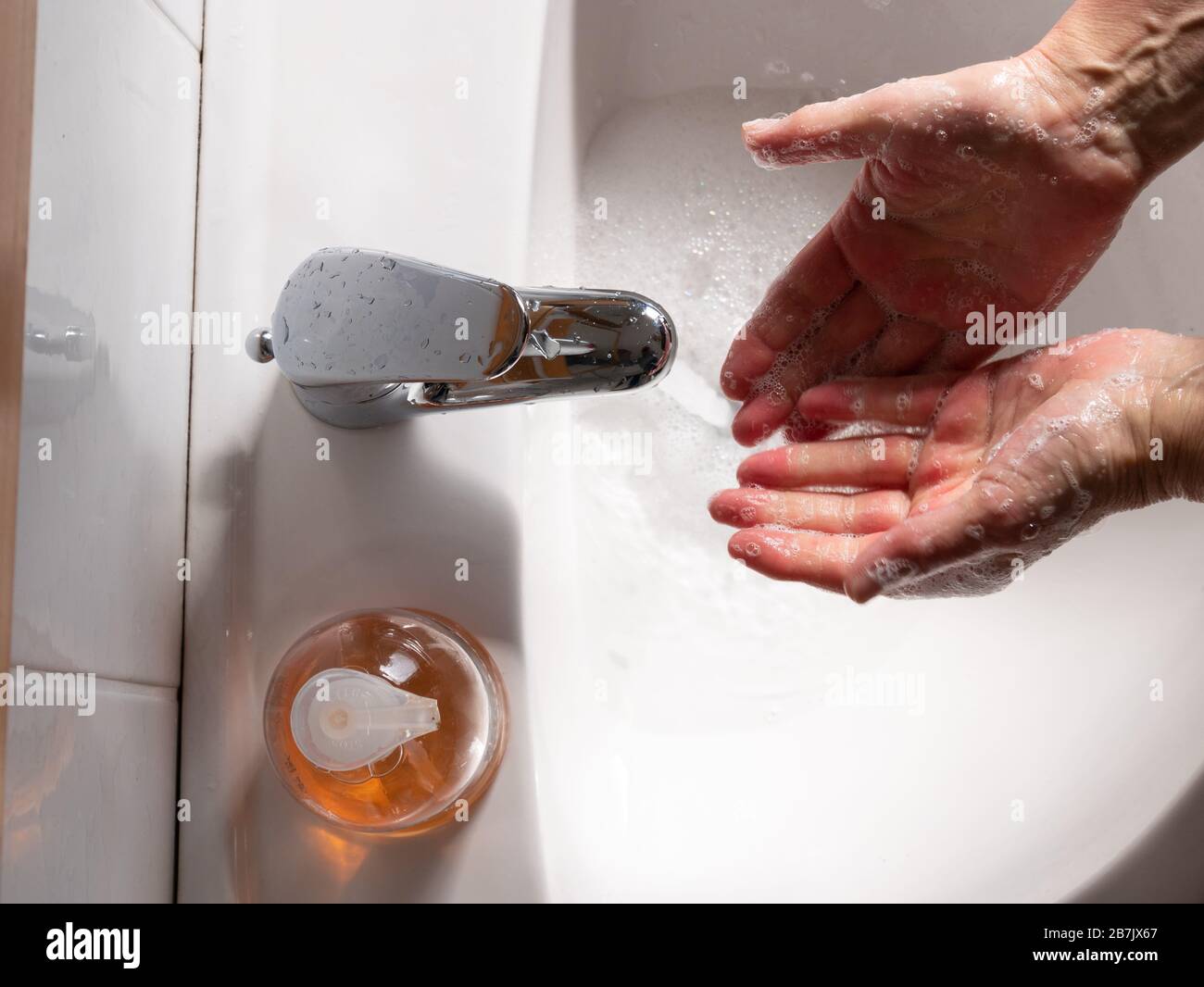 Washing hands as protection against disease germs Stock Photo - Alamy
