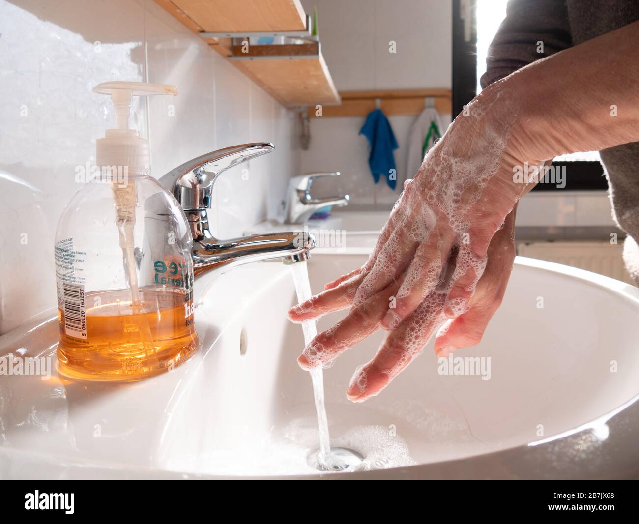 Washing hands as protection against disease germs Stock Photo - Alamy