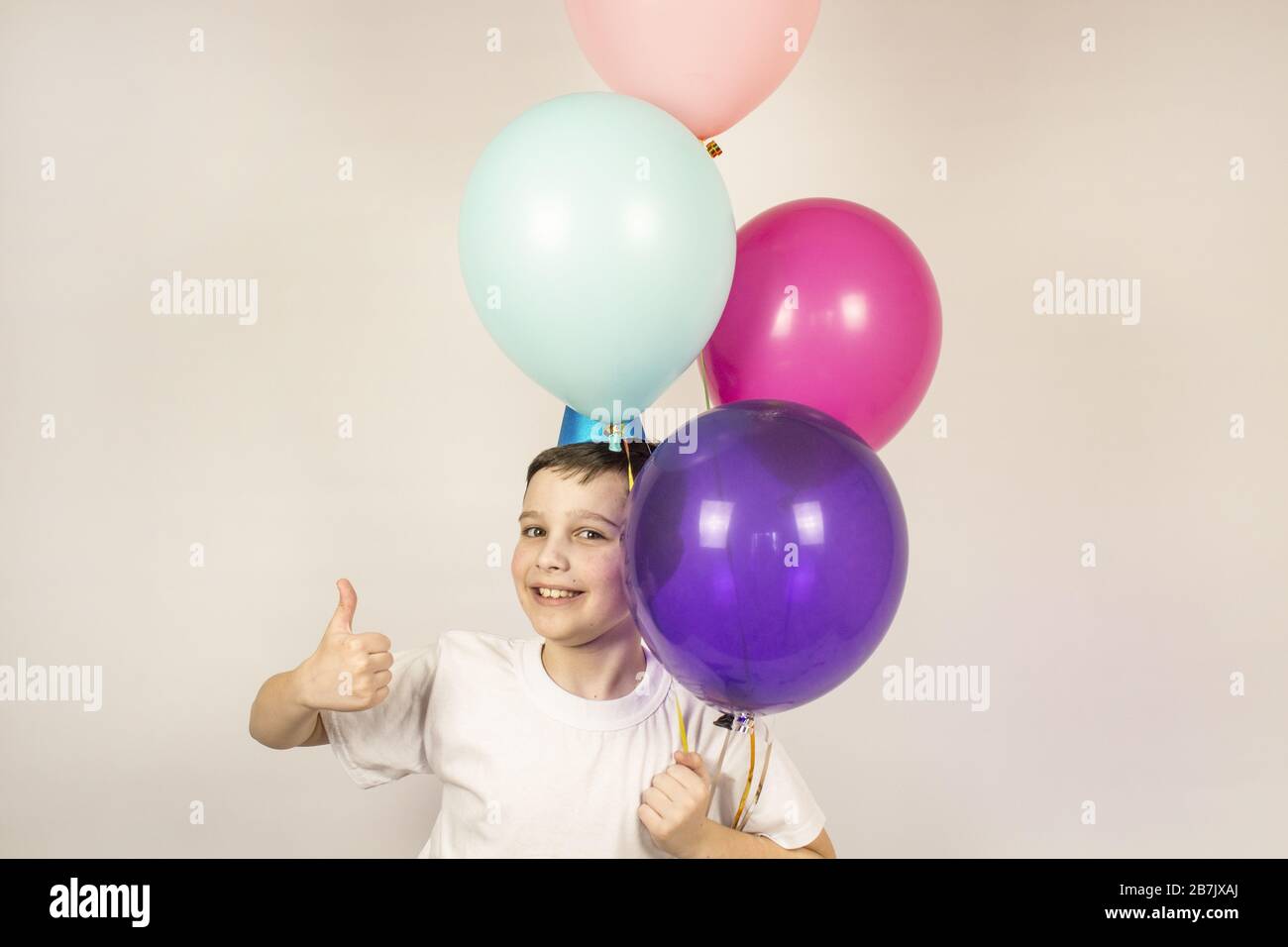 Joyful boy posing during his birthday. Boy with balloons. Banner ...