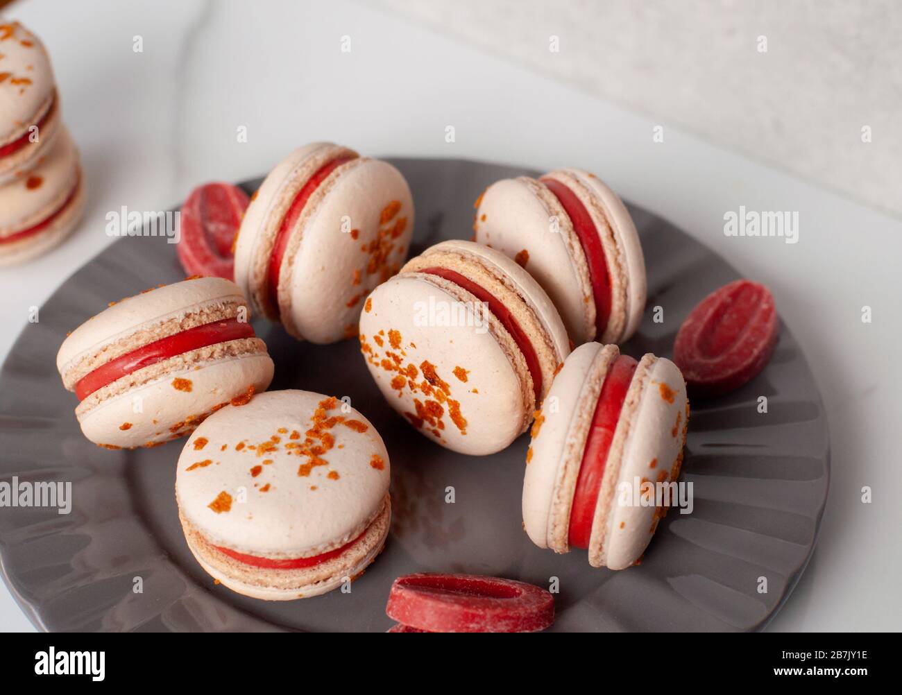 Strawberry macarons on the plate Stock Photo - Alamy