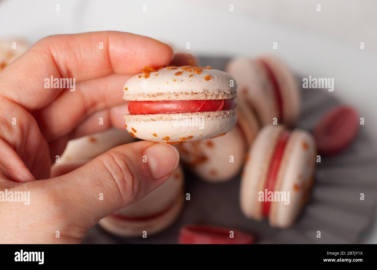 Macaron hands hi-res stock photography and images - Alamy