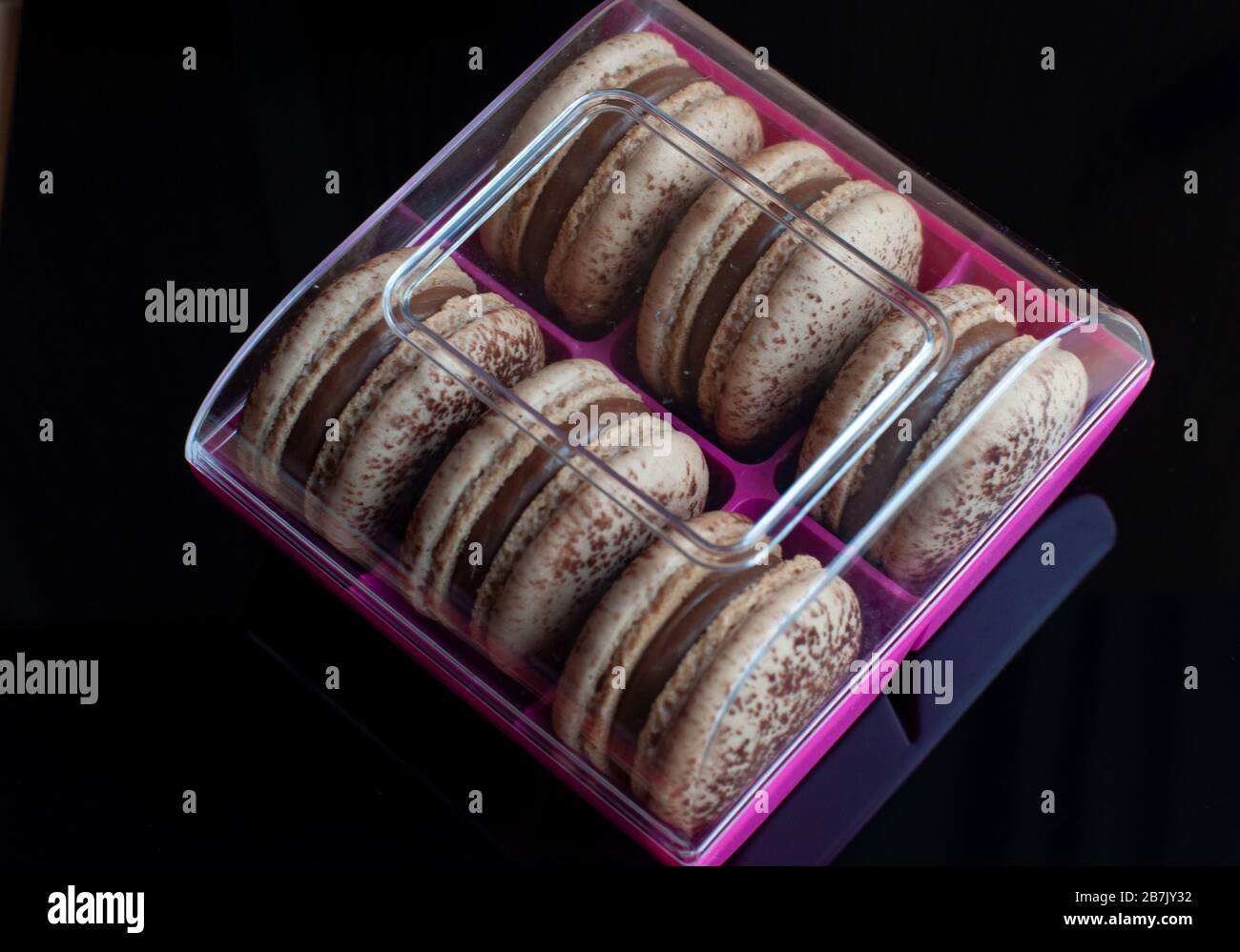Chocolate macarons inside plastic box Stock Photo - Alamy