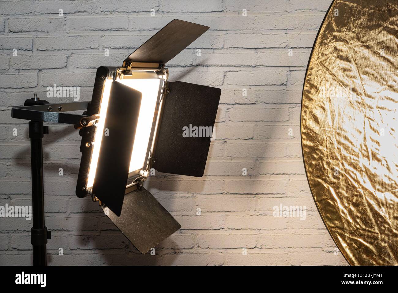 Bright spotlight and gold reflector positioned in front of a binary ...
