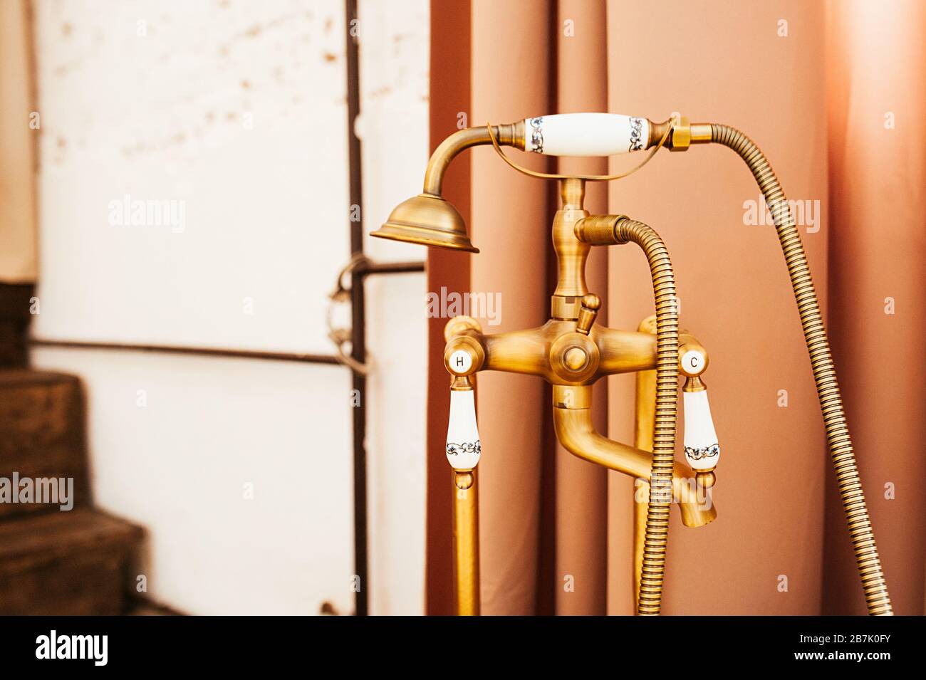 Old vintage gold faucet for hot and cold bath water and shower handle ...