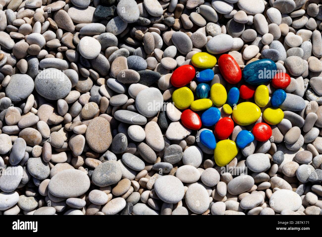 World autism awareness day. Top view to white beach stones with ...